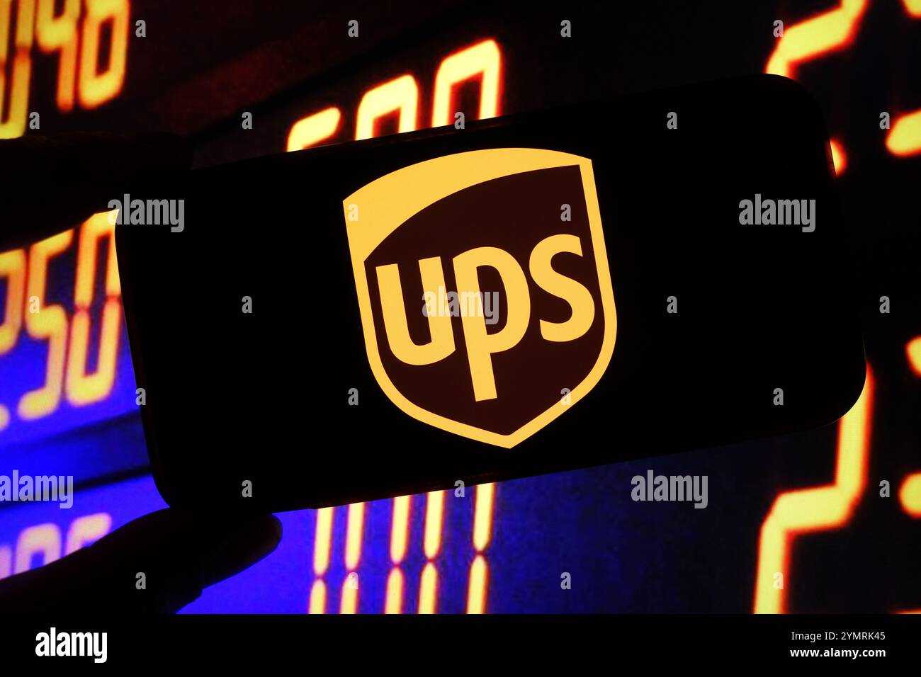 In this photo illustration, the United Parcel Service company logo is ...