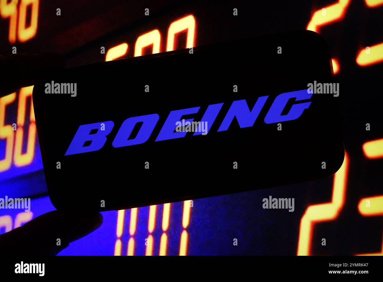 In this photo illustration, the Boeing company logo is seen displayed ...