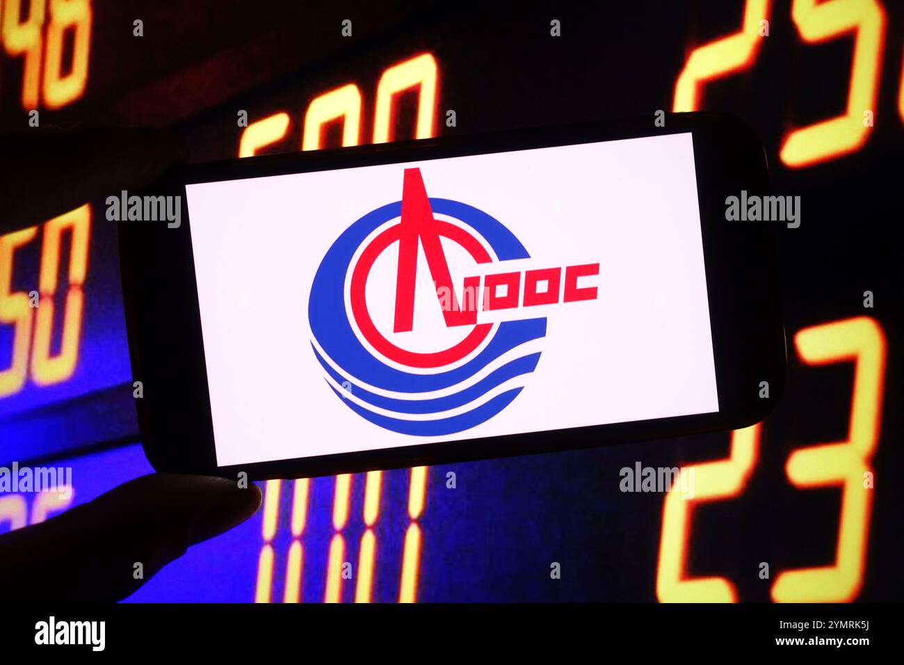In this photo illustration, the CNOOC company logo is seen displayed on ...