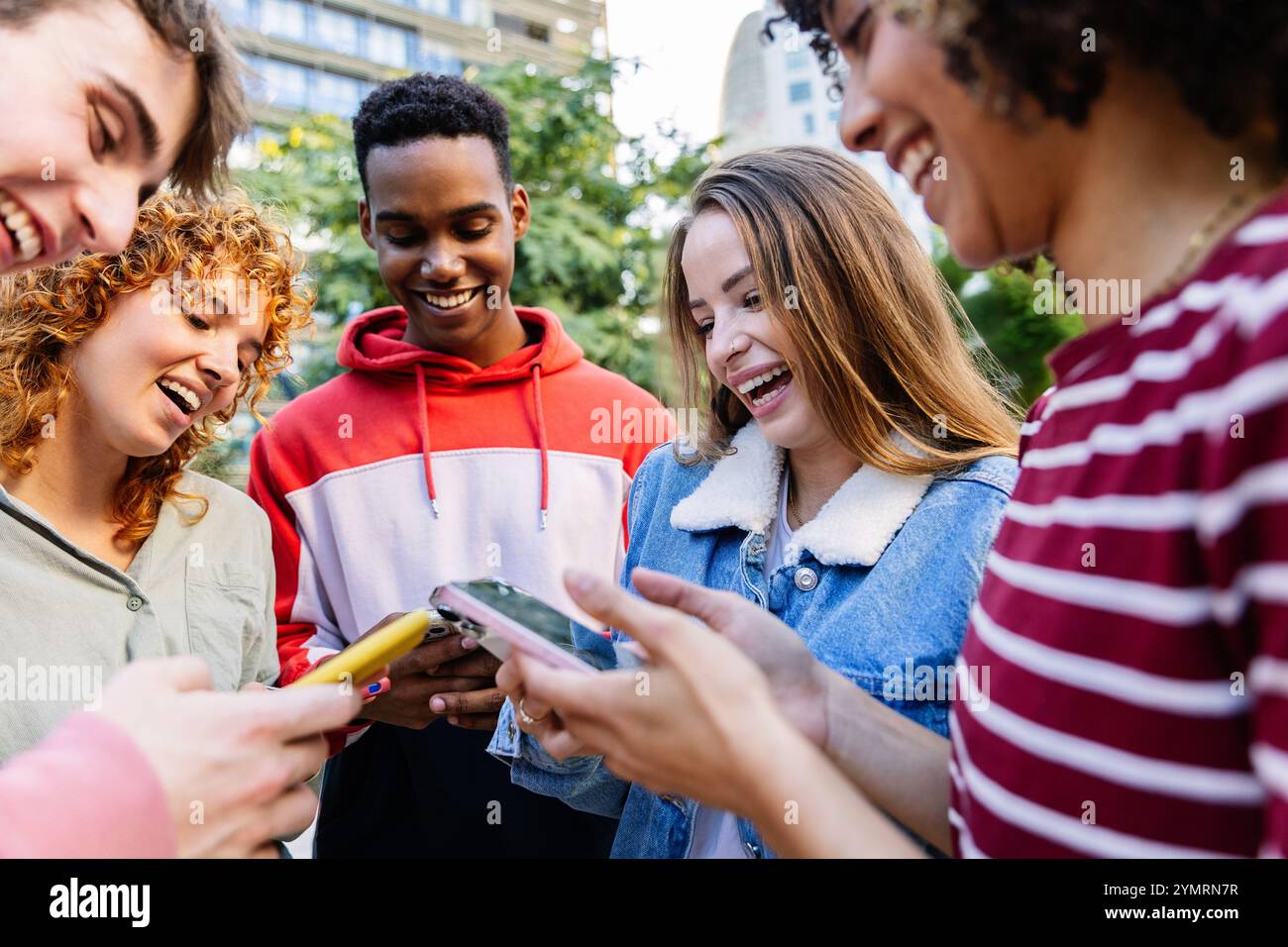 Group young cheerful people watching hi-res stock photography and ...