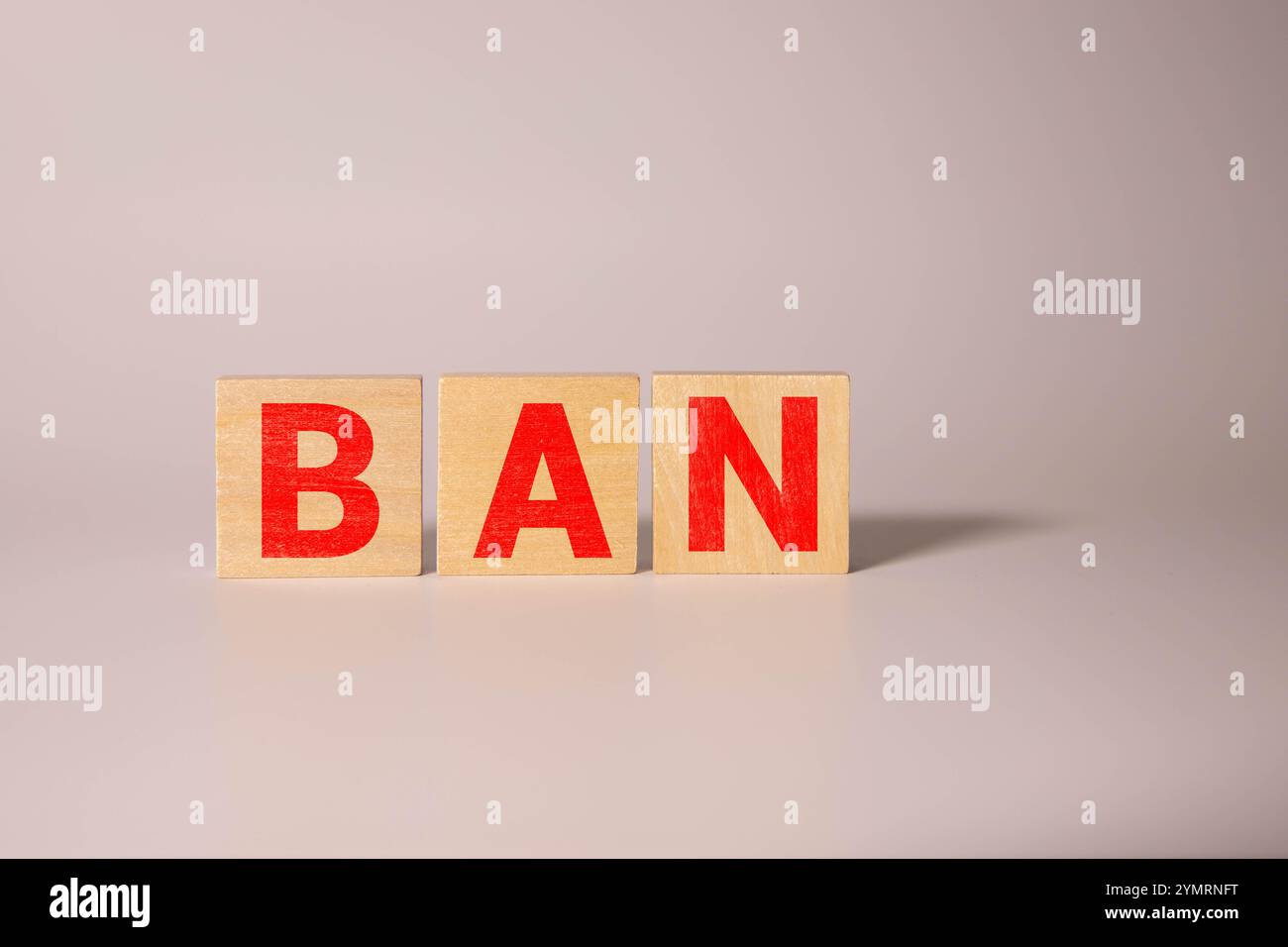 Ban represented by wooden letter tiles on a black background Stock ...