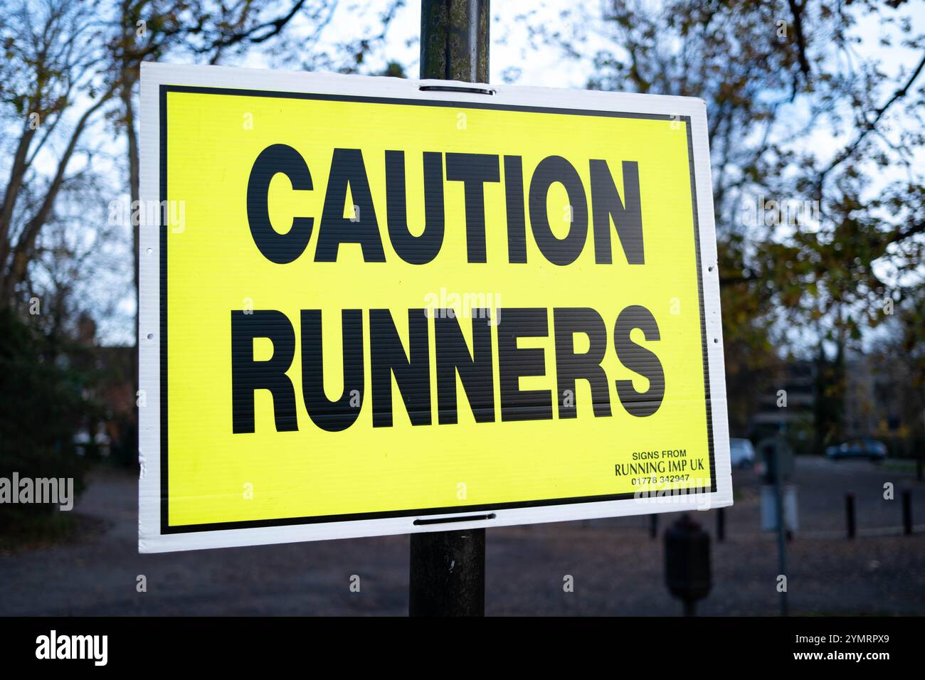 Signage in Crystal Palace park which reads 'CAUTION RUNNERS' Stock ...