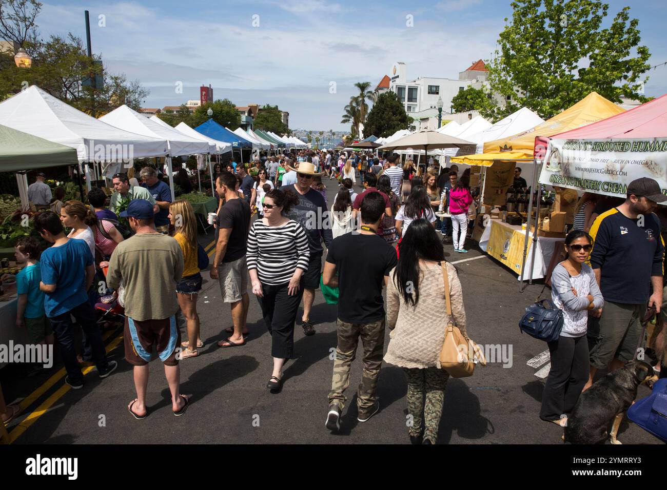 People gather to shop amid the stalls of food, clothes and hand made ...