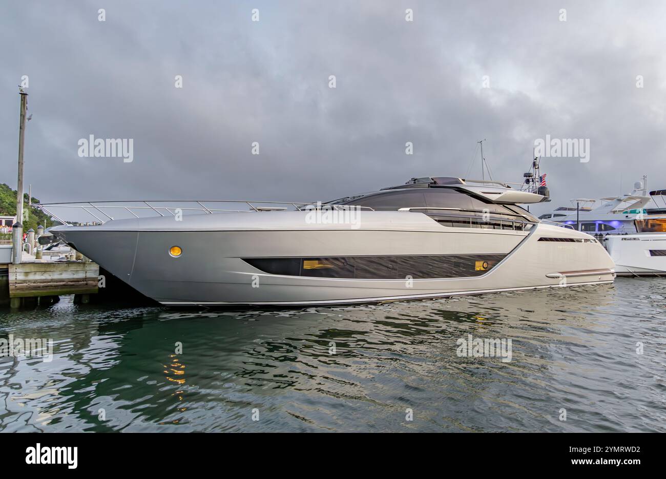 sleek and modern motor yacht at dock in three mile harbor Stock Photo ...
