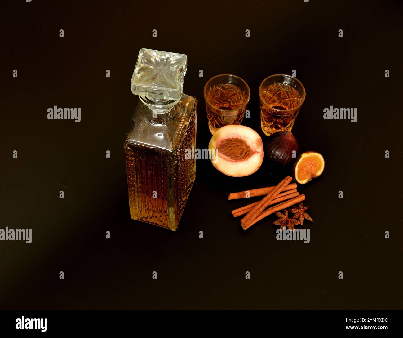 Fig-peach liqueur with cinnamon and anise, strong alcohol in a crystal ...