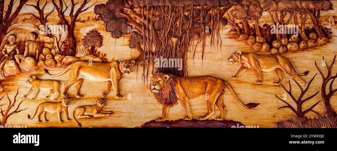 Wooden bas relief carving depicting a pride of lions in african savanna ...
