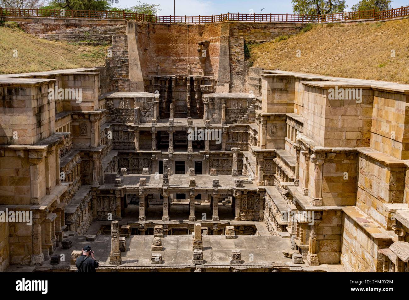 Photographer taking pictures of the intricate architecture of adalaj ...