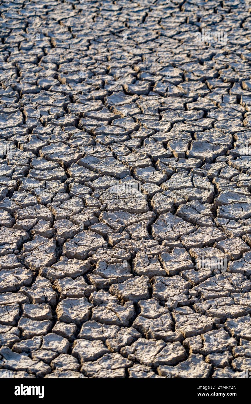 Dry, cracked earth illustrates the severe drought conditions affecting ...