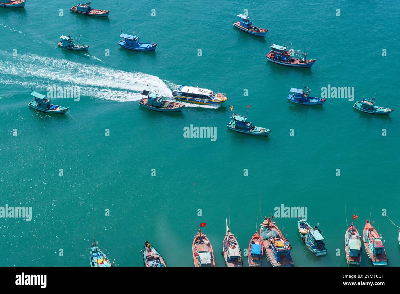 A boat is sailing in the middle of a large body of water, surrounded by ...
