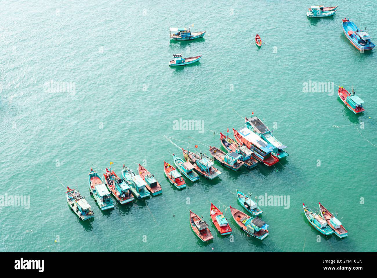 A large body of water with many boats in it. The boats are of various ...