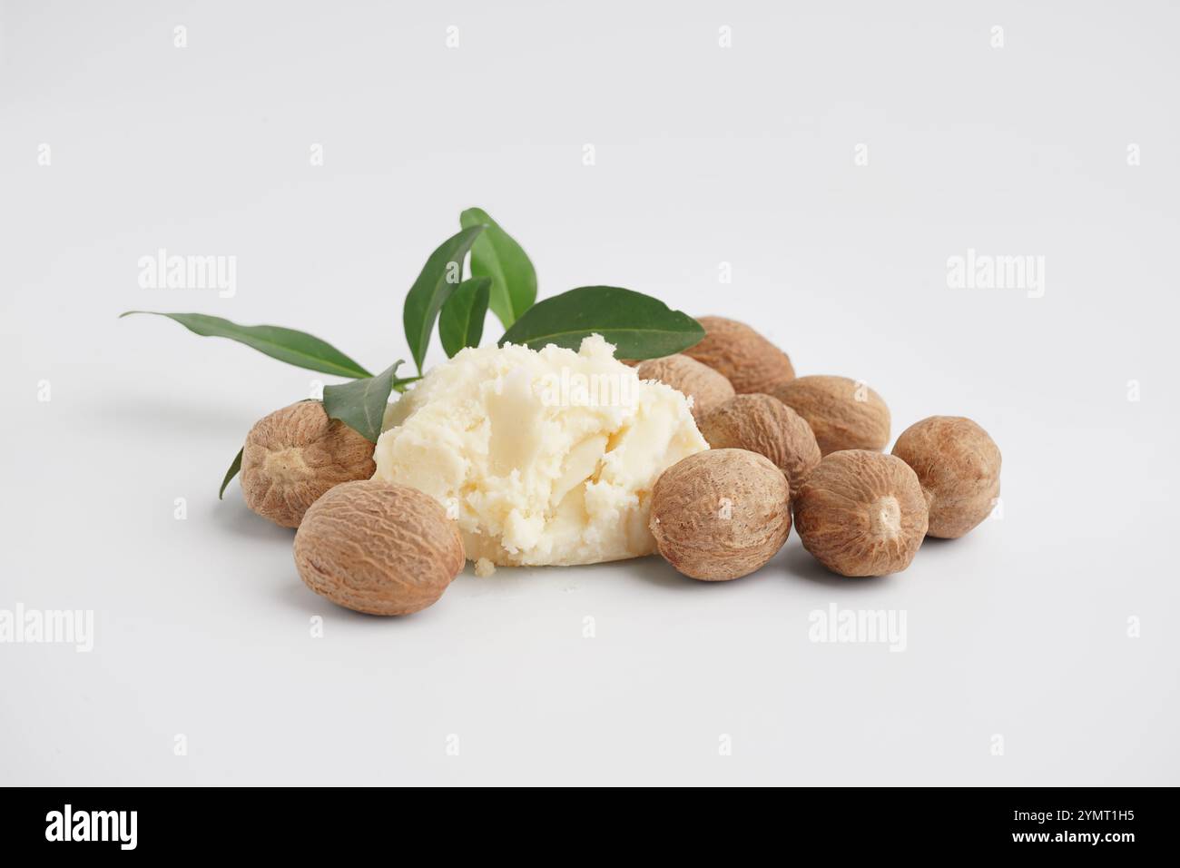 Healthy shea butter with nuts on white background Stock Photo - Alamy