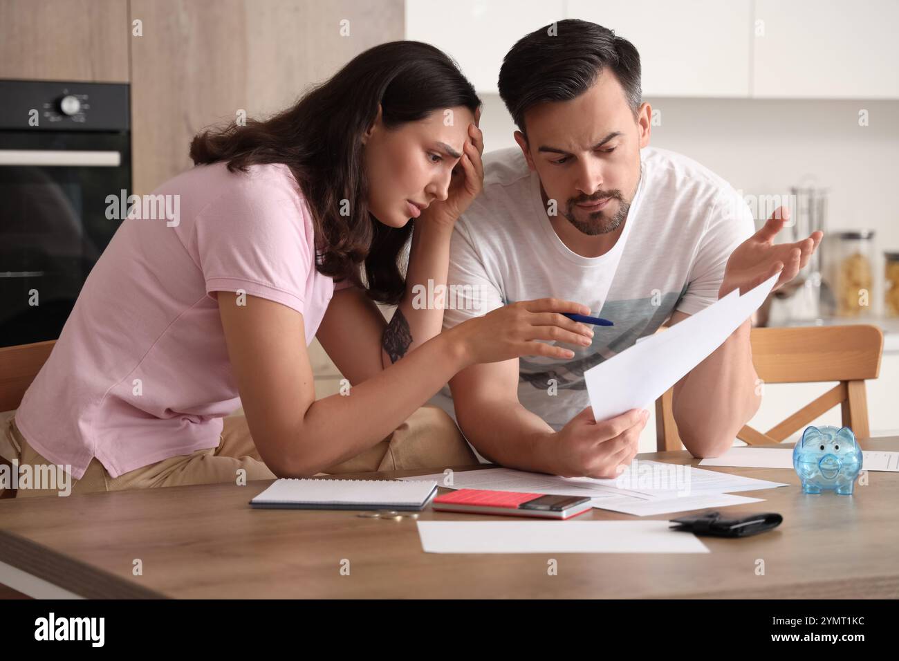 Young couple doing calculation hi-res stock photography and images - Alamy