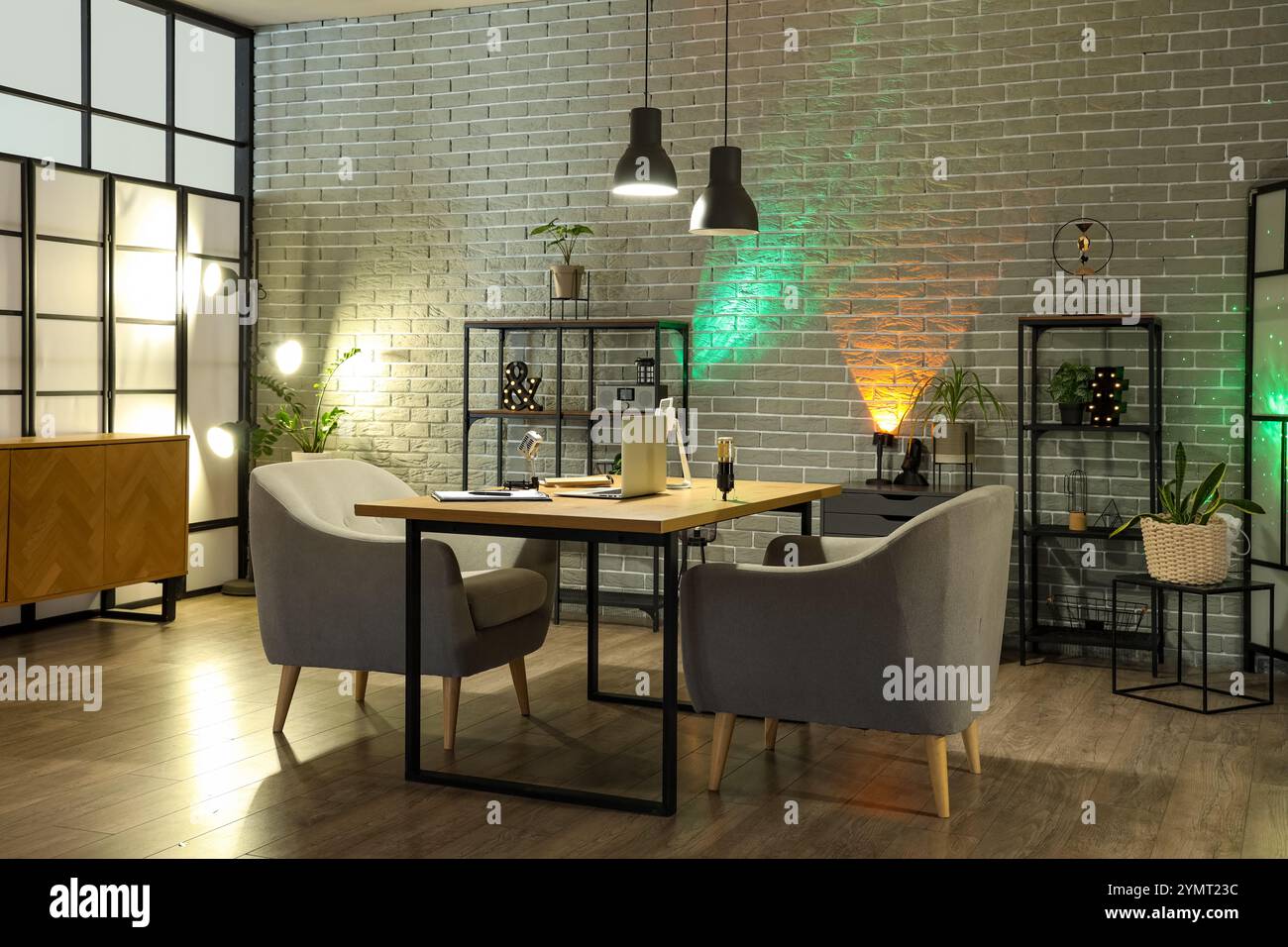 Interior of dark studio with podcaster's workplace, shelf units and ...