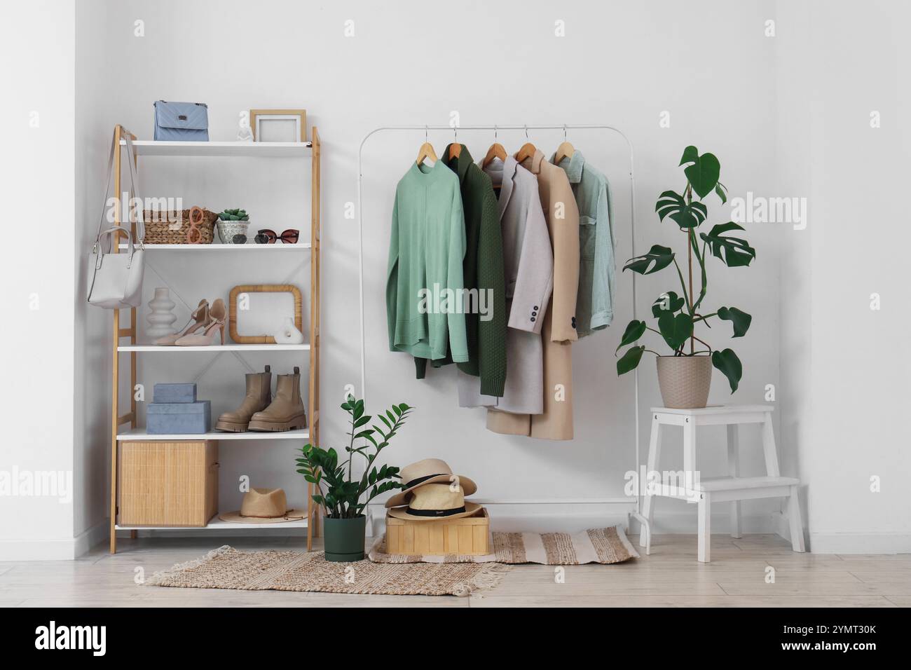 Interior of dressing room with clothes rack and shelf unit Stock Photo ...