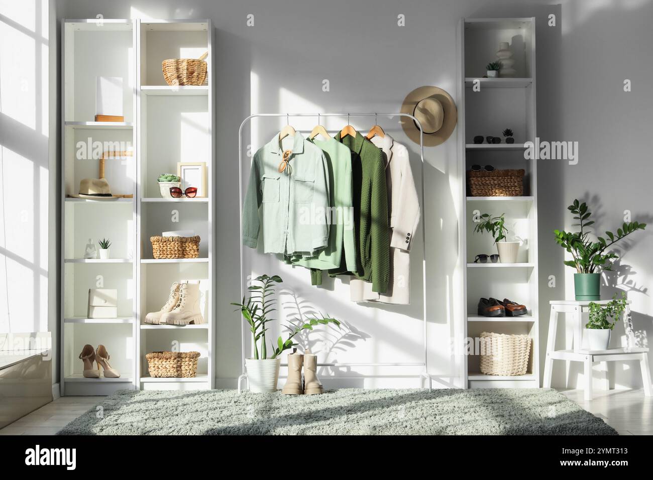 Interior of dressing room with clothes rack and shelf units Stock Photo ...