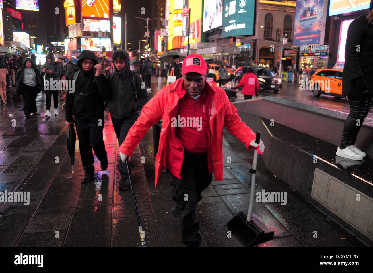 New York, United States. 22nd Nov, 2024. A person carries a dust pan in ...