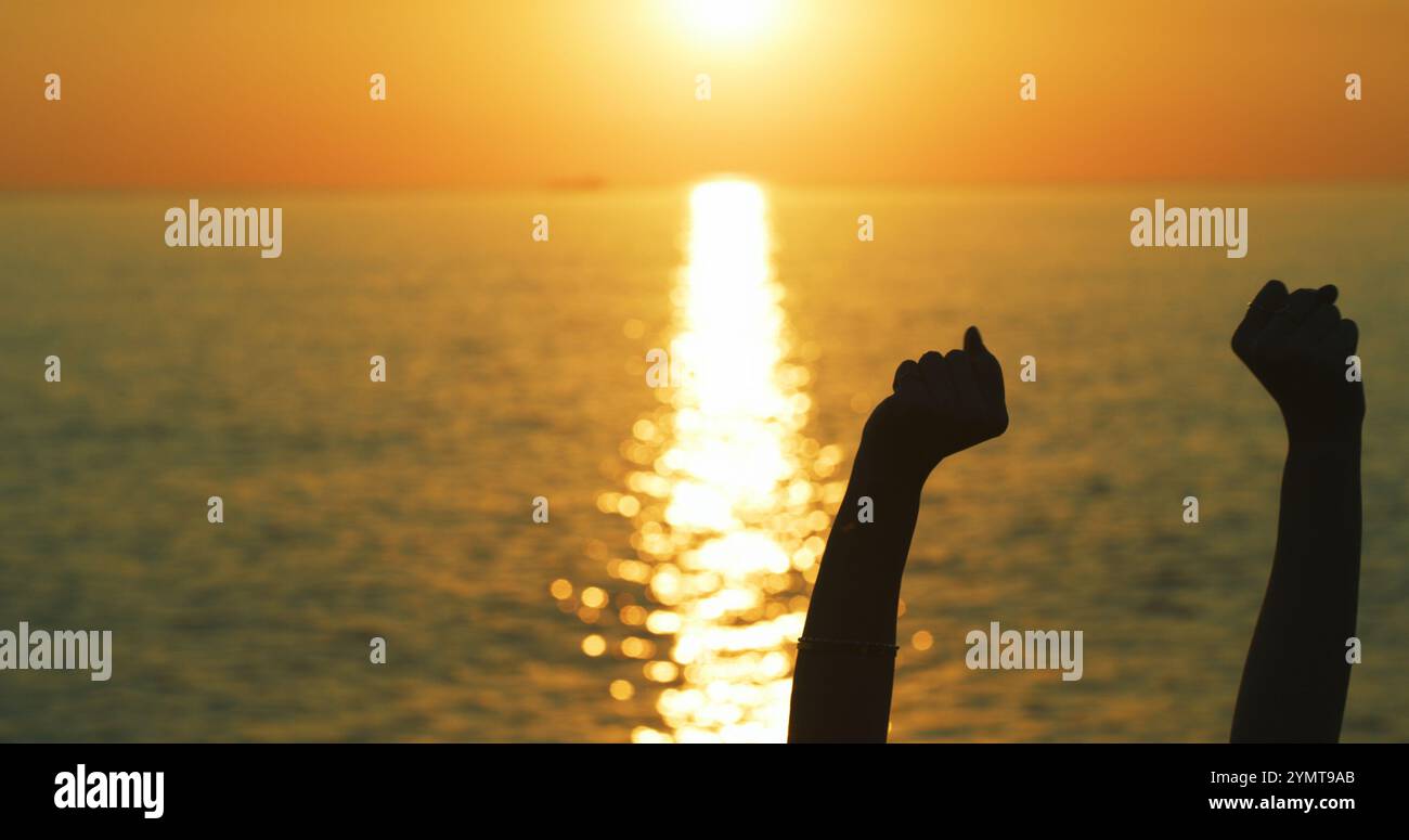 Sunset, freedom and hands of person at beach for summer vacation ...