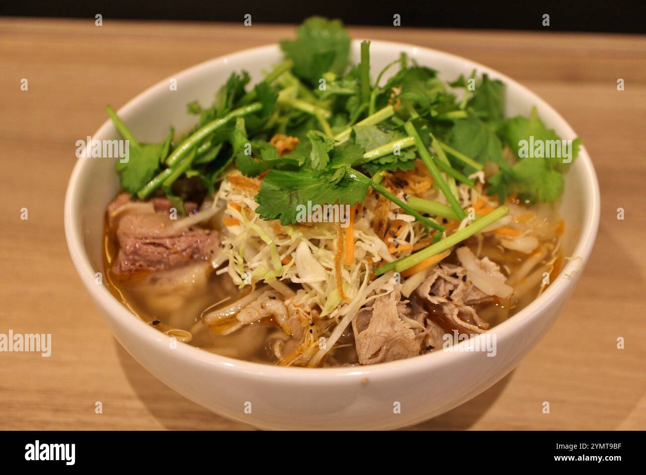 Vietnamese cuisine: bun bo hue (spicy rice noodles with beef tendon and ...