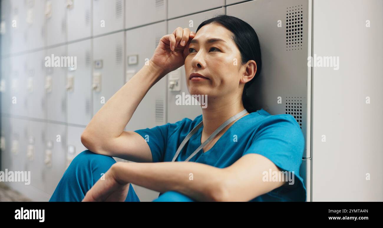 Japanese, woman and nurse with stress in hospital of healthcare fatigue ...