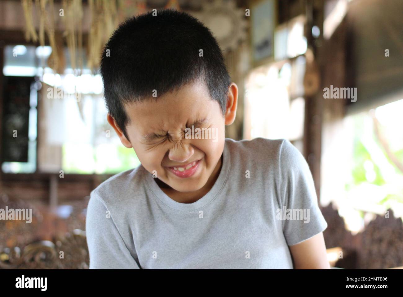 A joyful child captured in a candid moment of happiness, showing a wide ...