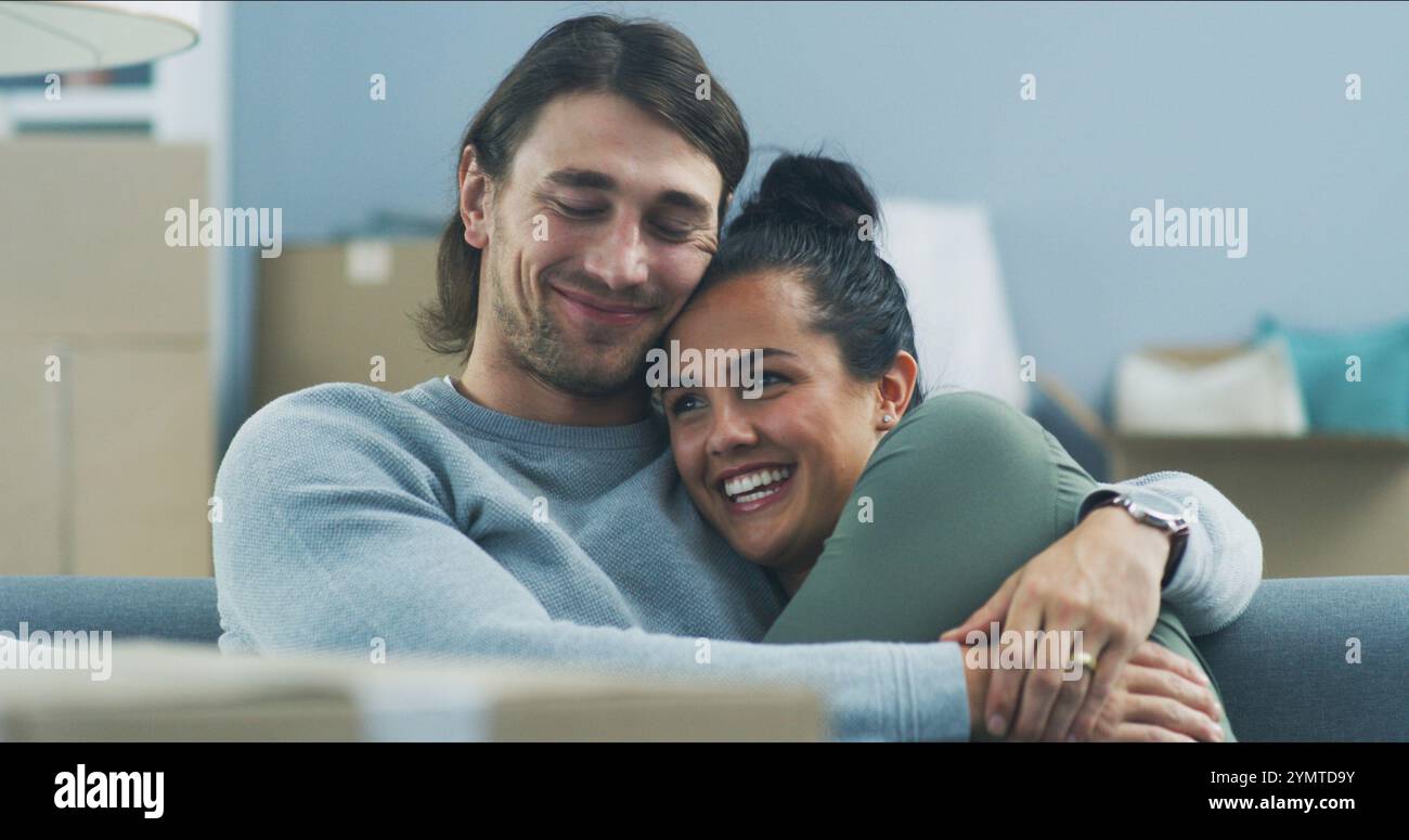 Happy couple, hug and sofa in new home with love, support and pride for ...