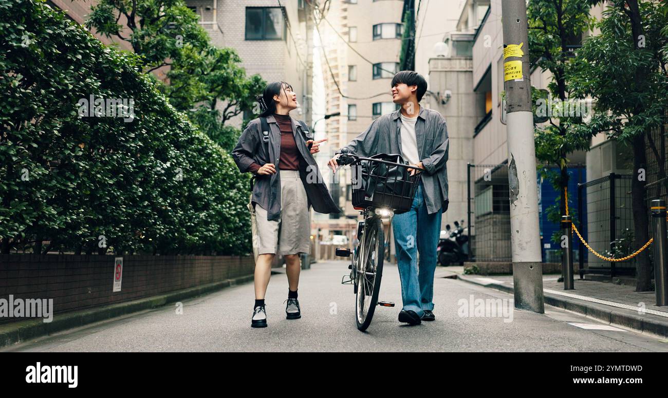 Fashion, walking and bike with Japanese couple in city for streetwear ...