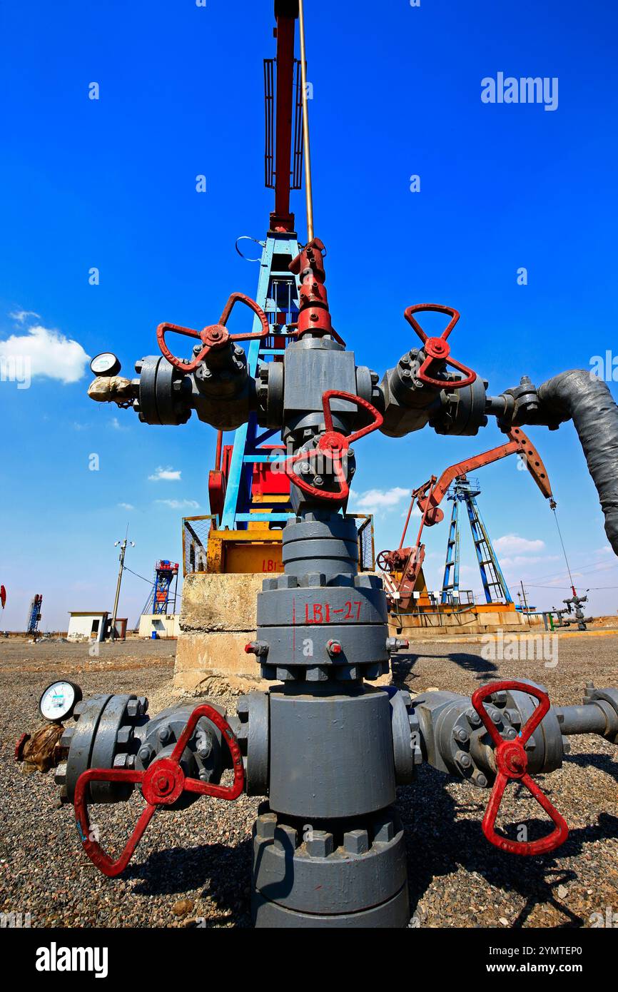 Oil pipes and valves Stock Photo - Alamy