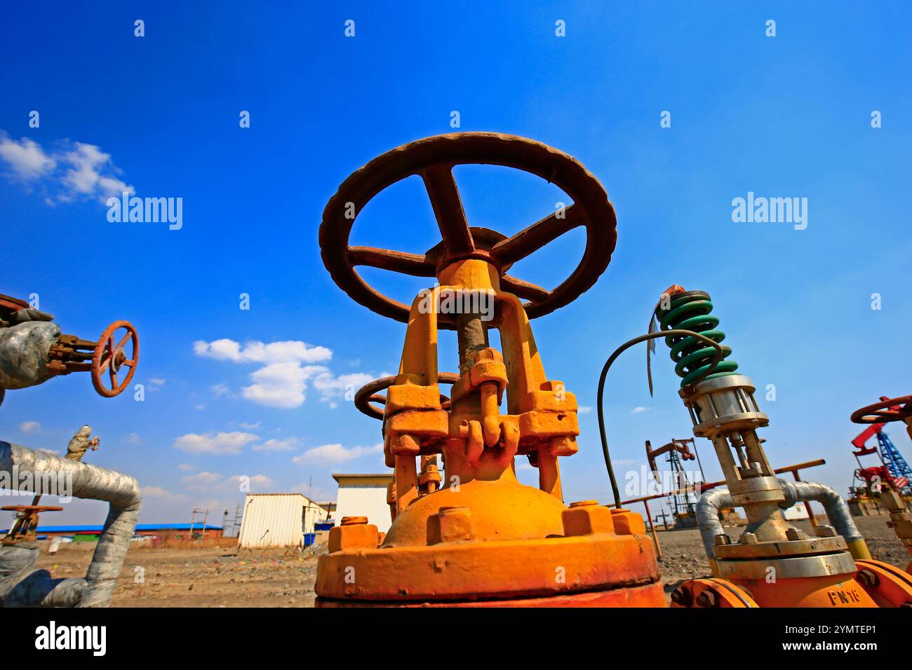 Oil pipes and valves Stock Photo - Alamy
