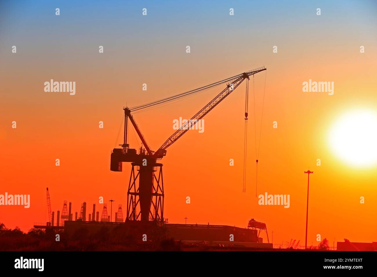 Port crane unloading container ships Stock Photo - Alamy