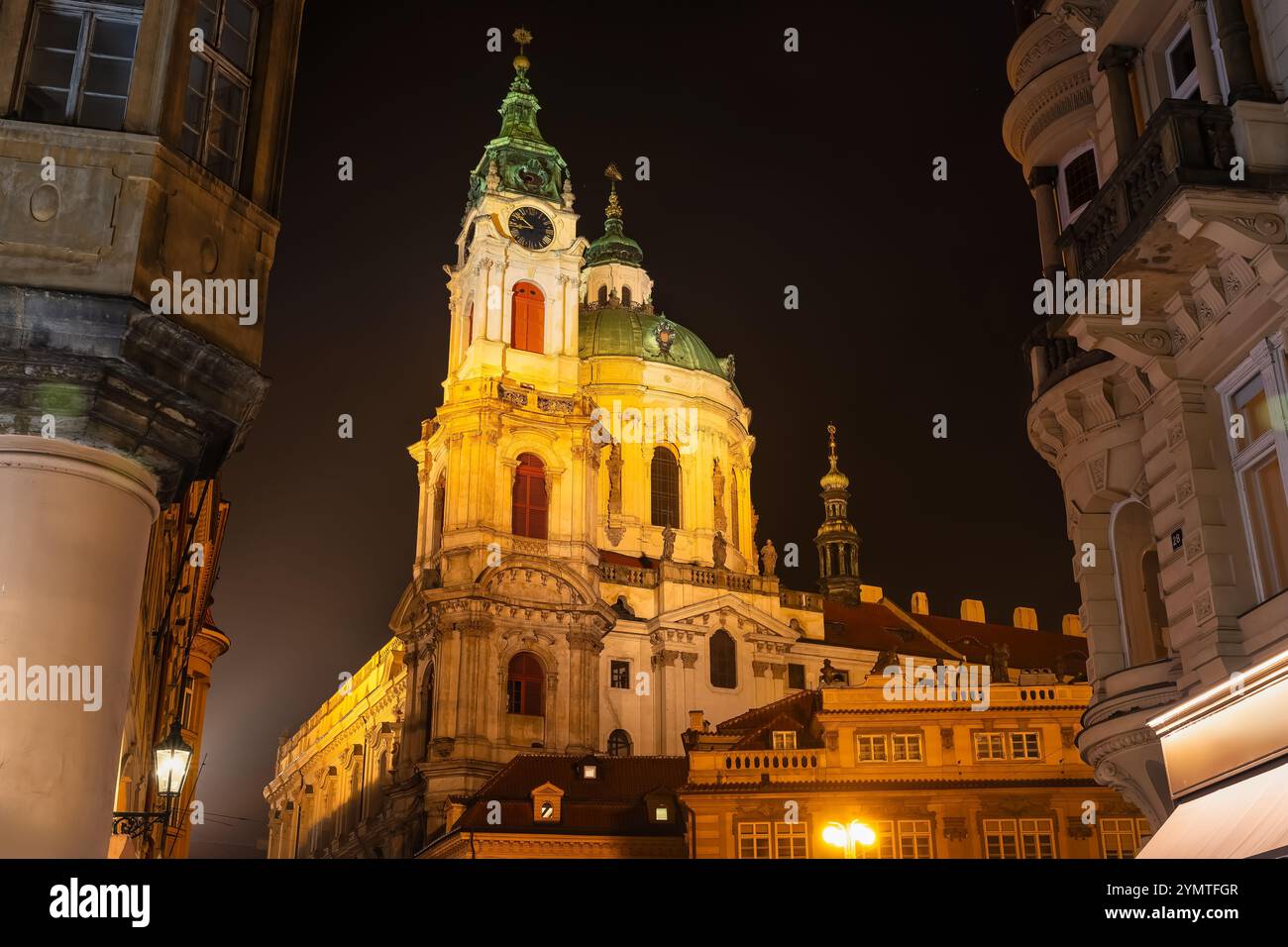 Stunning St. Nicholas Church illuminated at night in the Unesco city of Prague, Czechia Stock ...