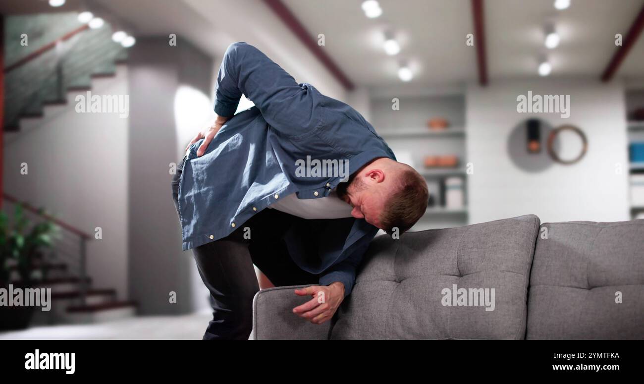 Lifting Heavy Couch Furniture, Man With Back Pain Stock Photo - Alamy