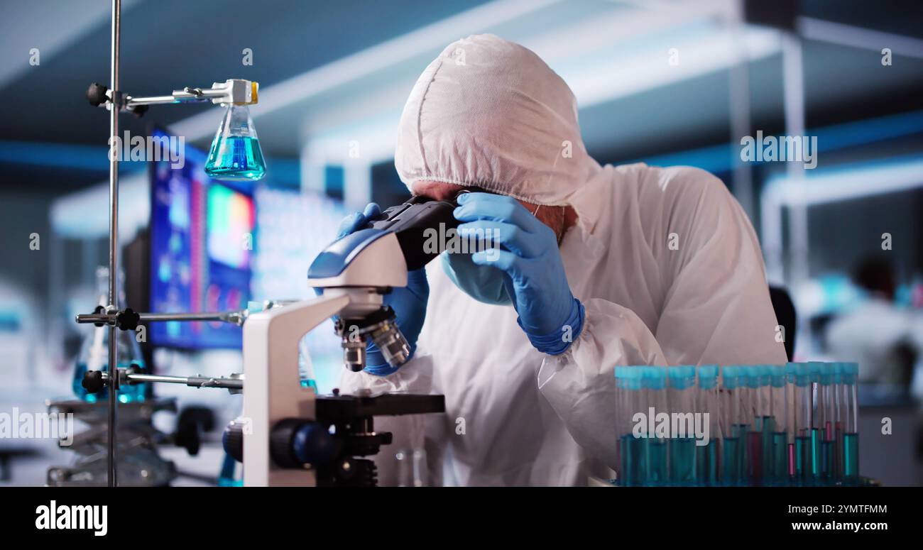 Research Lab Scientist Doing Medical Scientific Test With Microscope ...