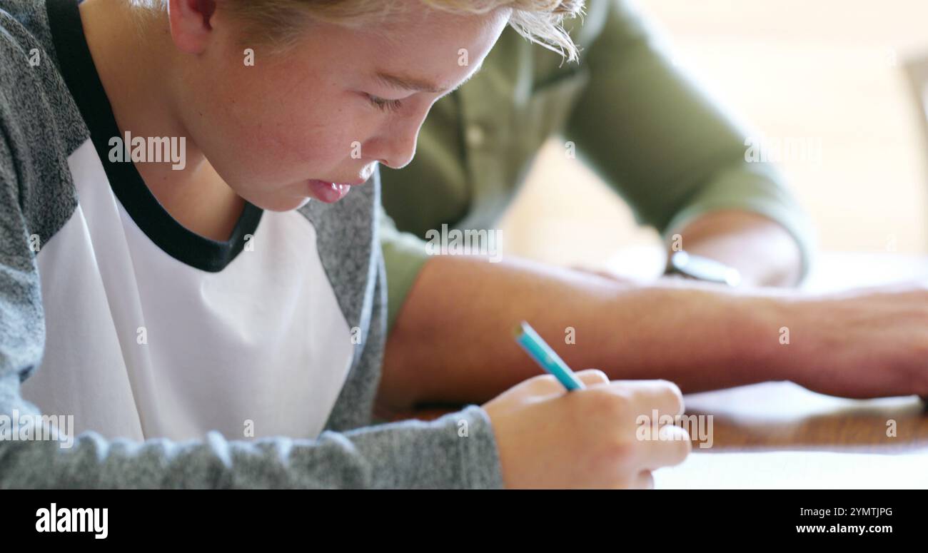 Boy, child and homework with writing in home for learning, development ...