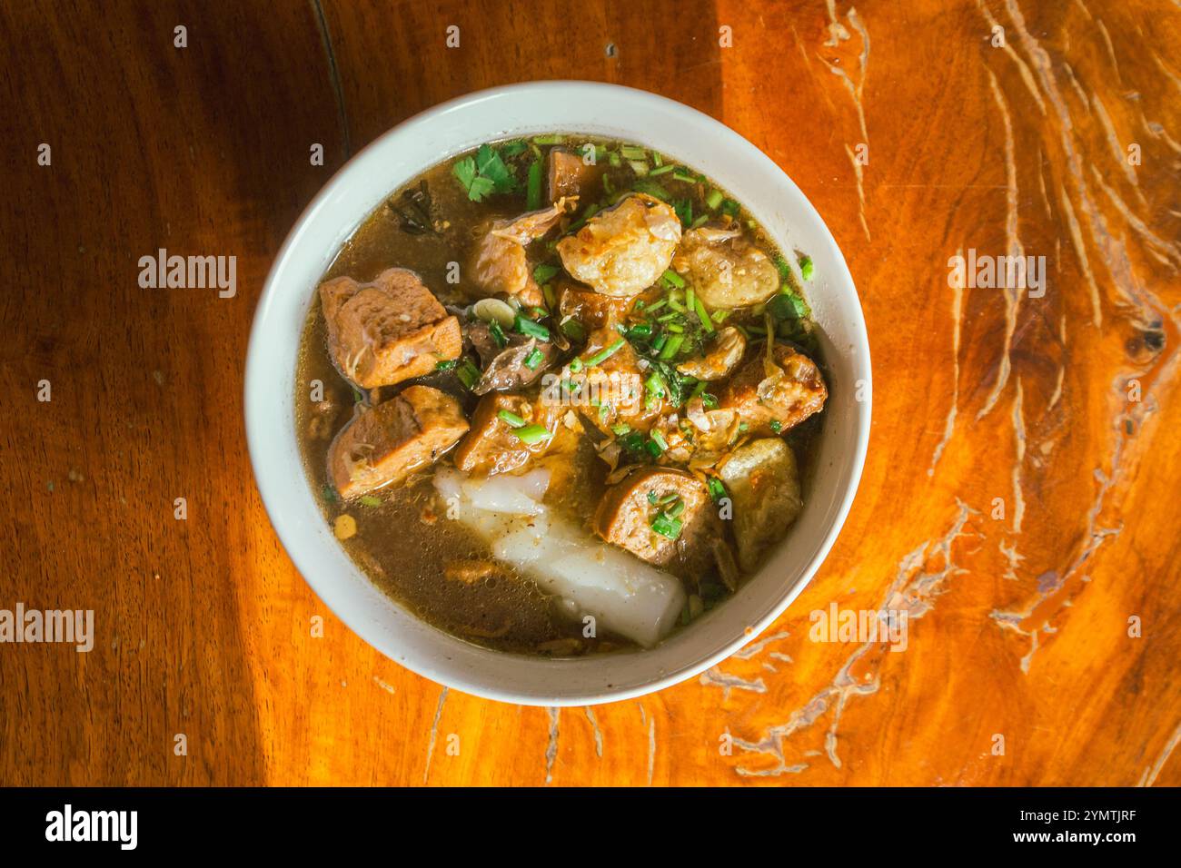 boiled Chinese pasta square on wood table for street food Asia concept ...