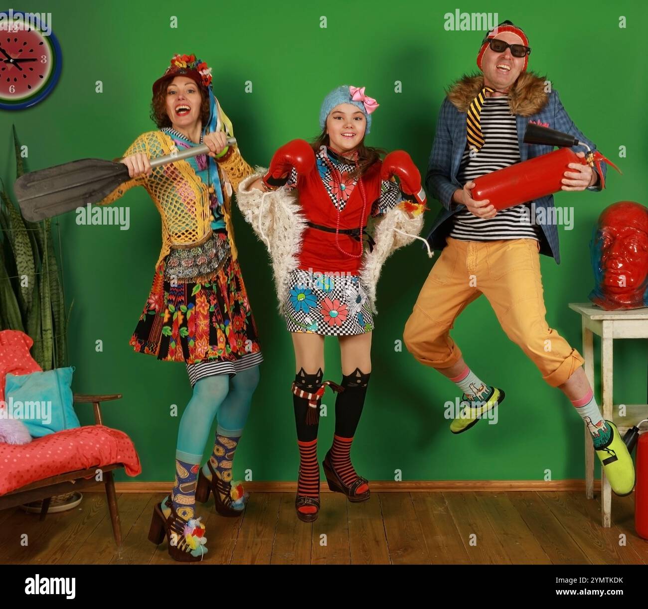 A freaky family dressed in color impossible clothes have fun in the ...