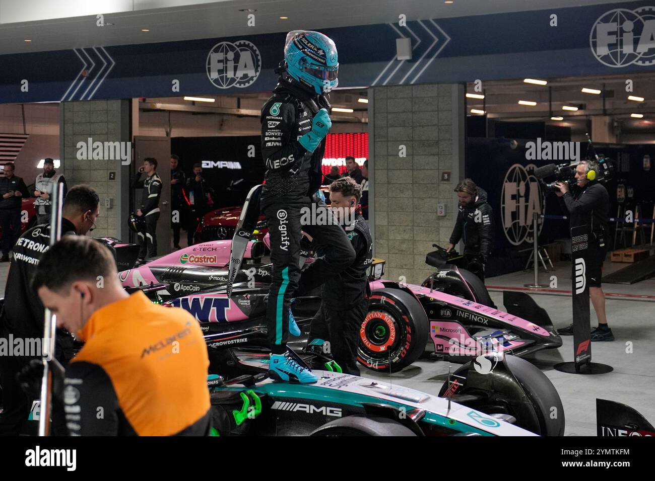 Mercedes driver George Russell, of Britain, reacts after winning the ...