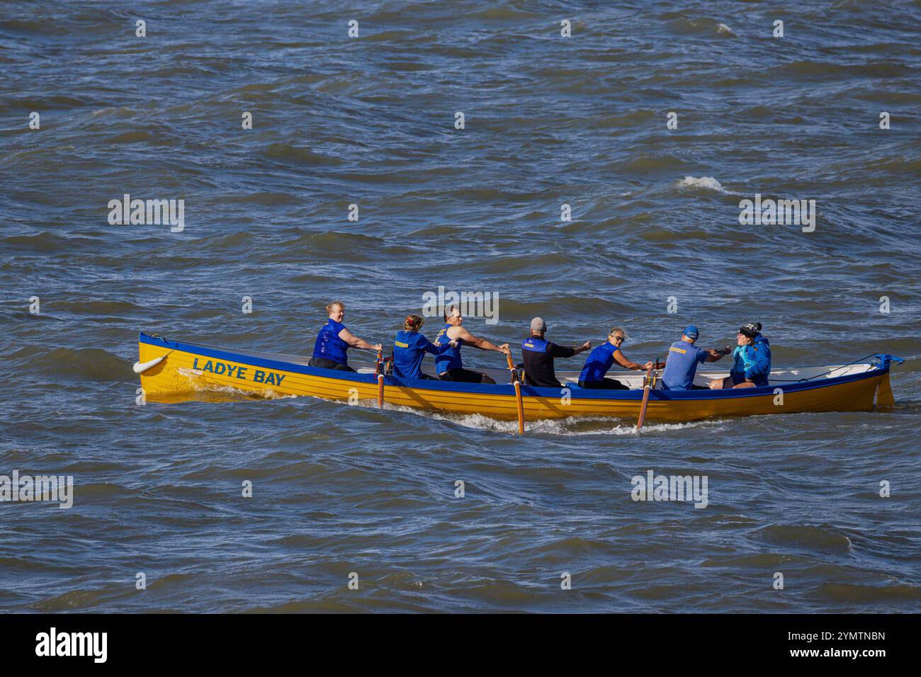 Pilot gig racing off Clevedon Beach with choppy sea Stock Photo - Alamy