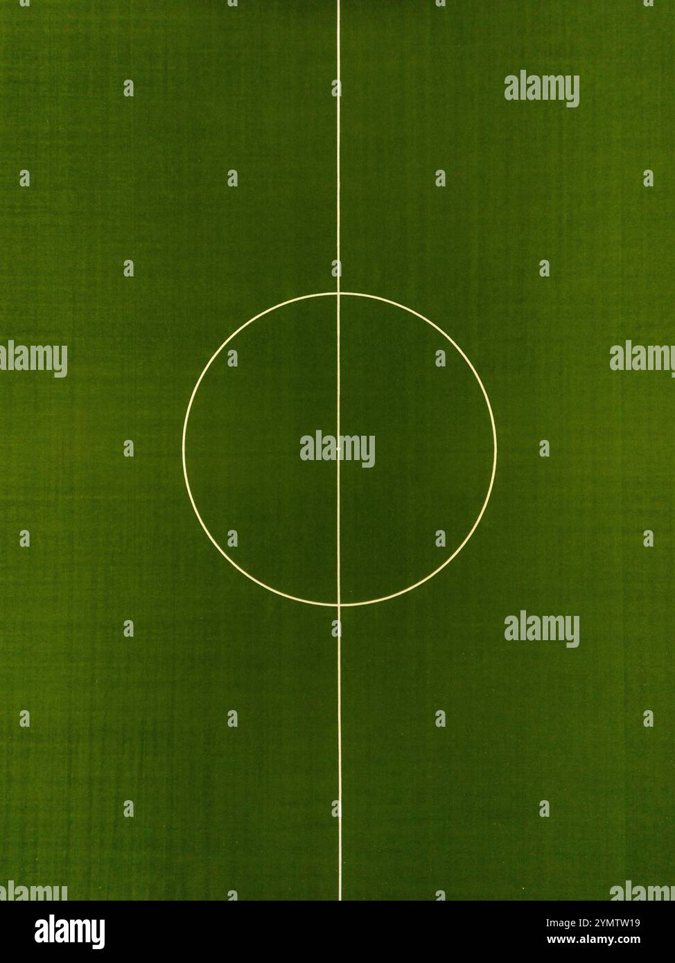 Green grass and white lines. Aerial closeup of the midfield circle in ...