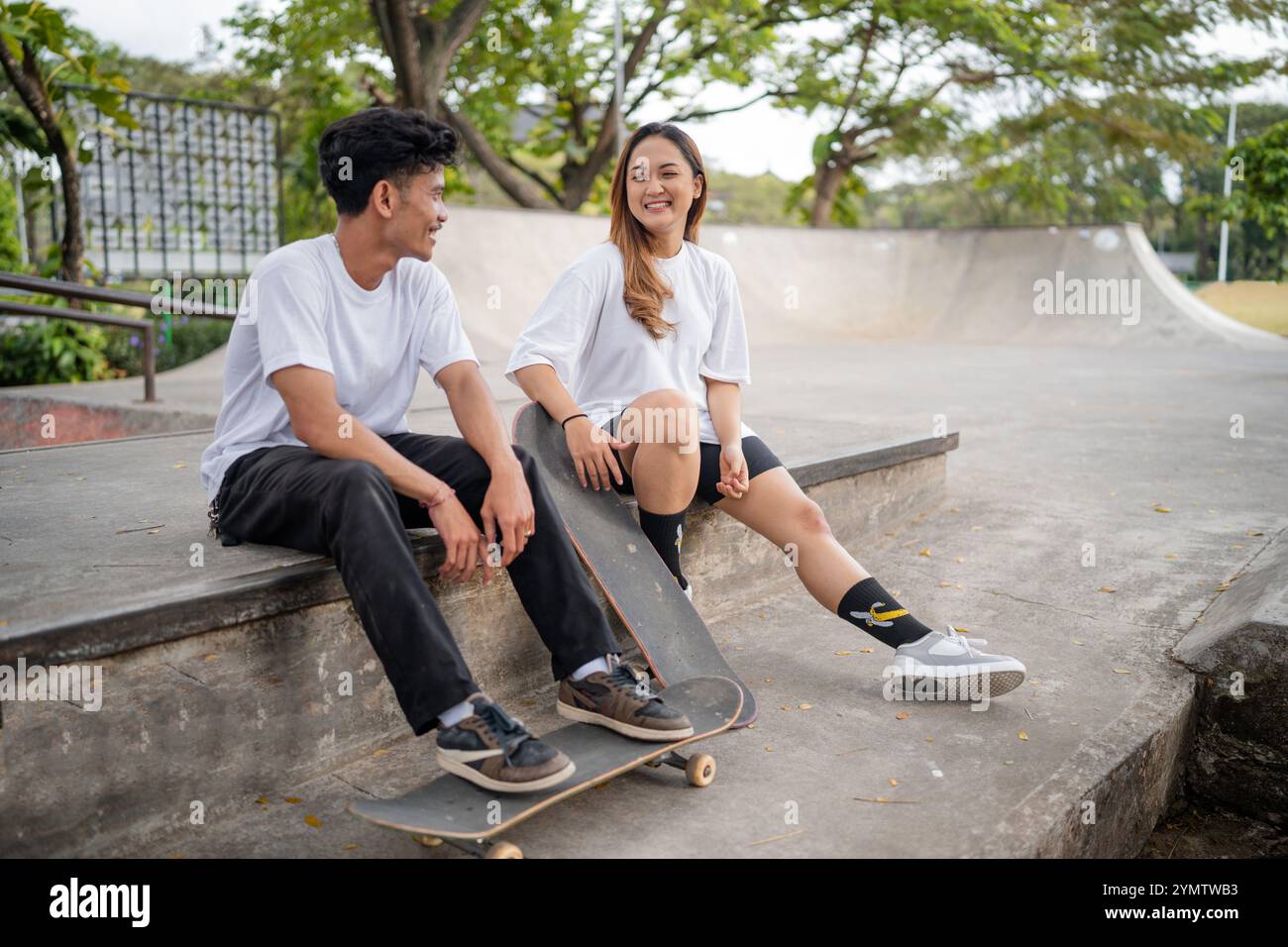 A Group of Friends Having Fun Together at the Skate Park While Riding ...