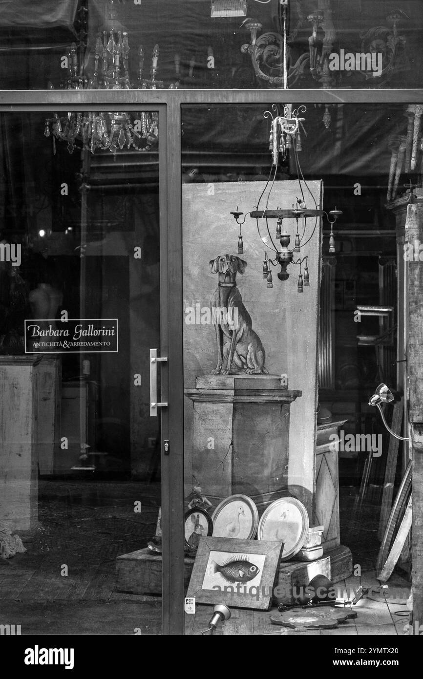 Shop window and interior of an antique store in Florence with old art ...