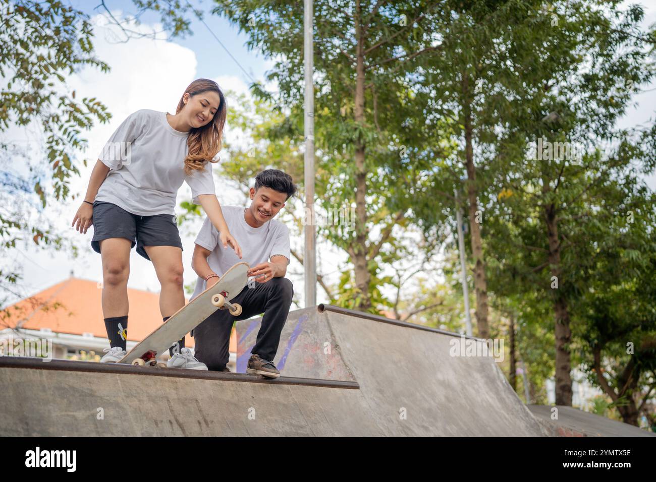 Young skaters practice tricks at their local skate park, showcasing ...