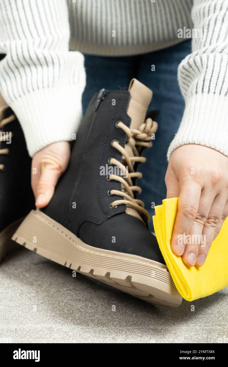 Shoe Care, Woman Wiping Cloth Surface Of Leather Shoe Stock Photo - Alamy