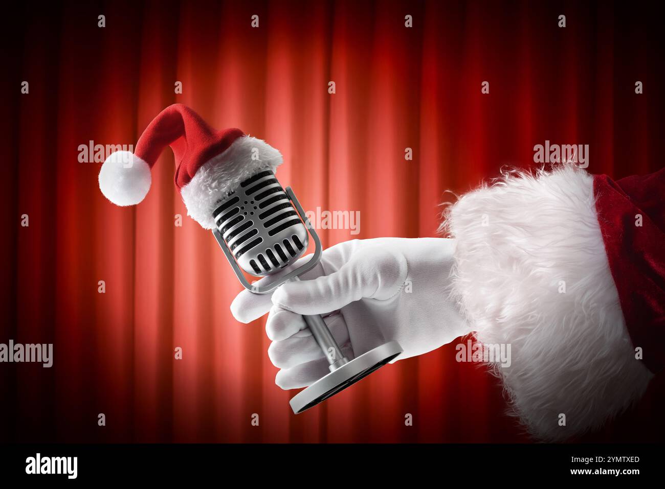 Santa Claus hand holding a retro microphone with a hat and a red ...