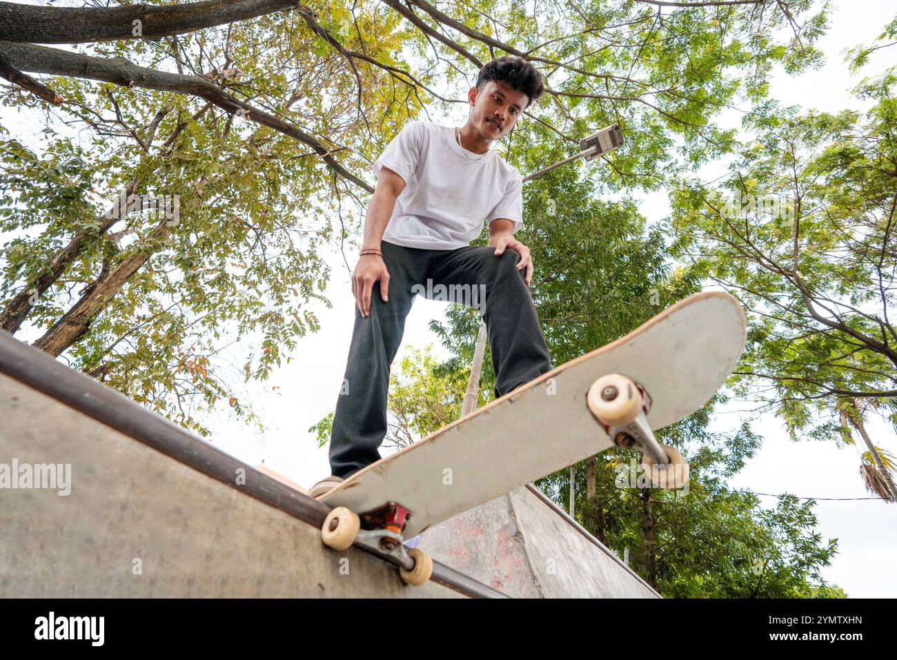 A skateboarder performs an impressive trick at a beautiful ...