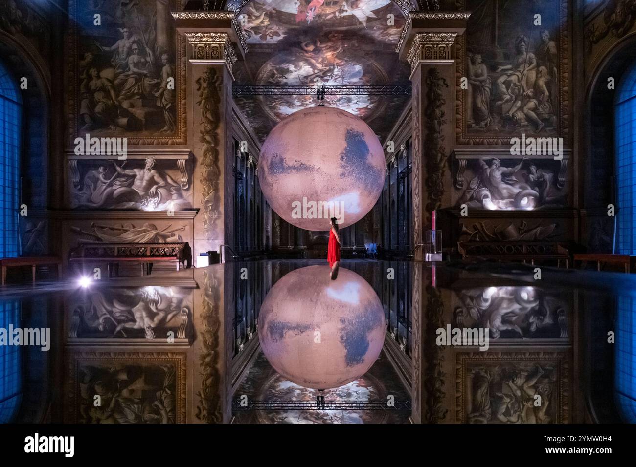 London, UK. 23 November 2024. A staff member with ‘Mars’ by artist Luke ...