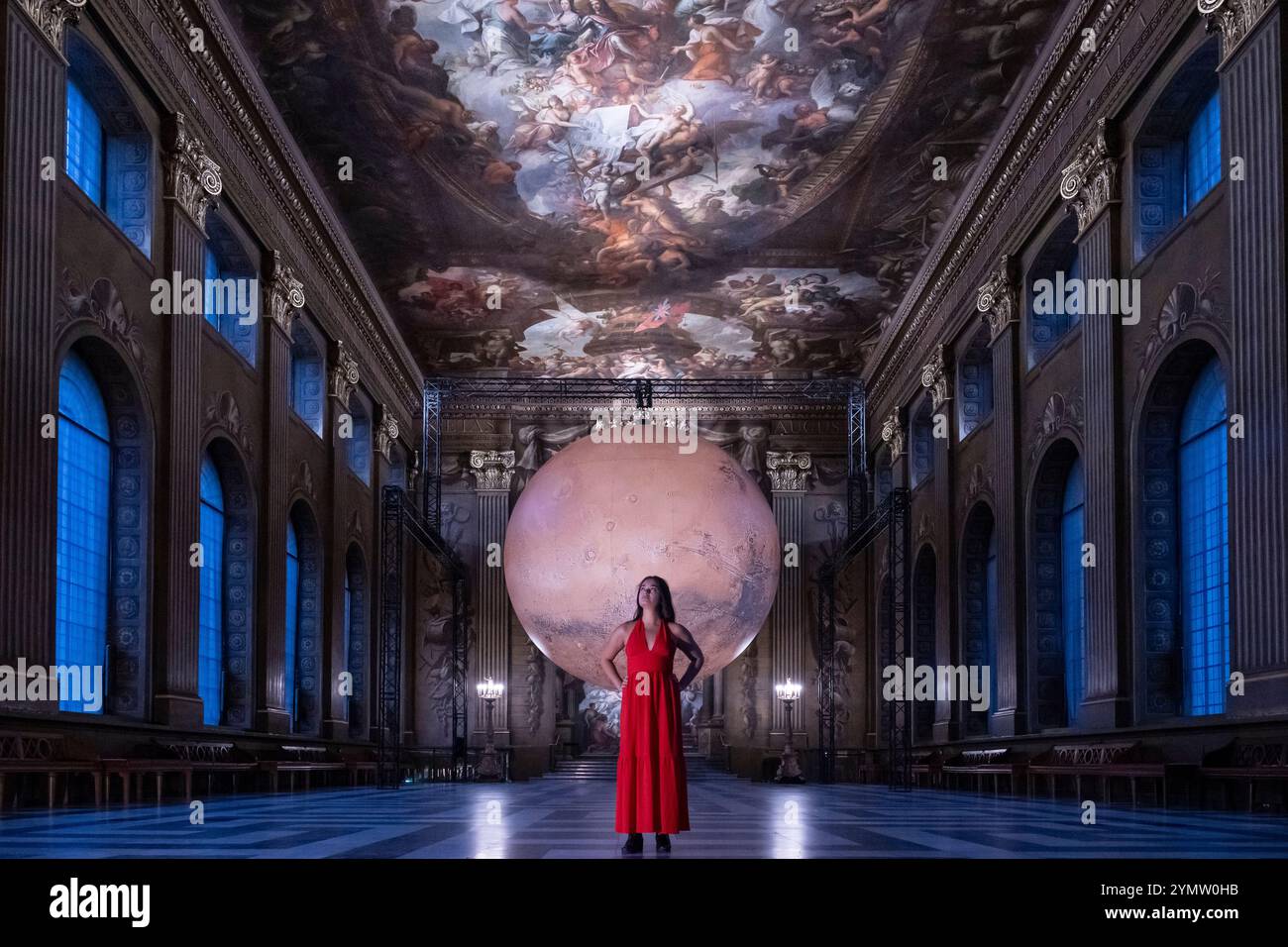 London, UK. 23 November 2024. A staff member with ‘Mars’ by artist Luke ...