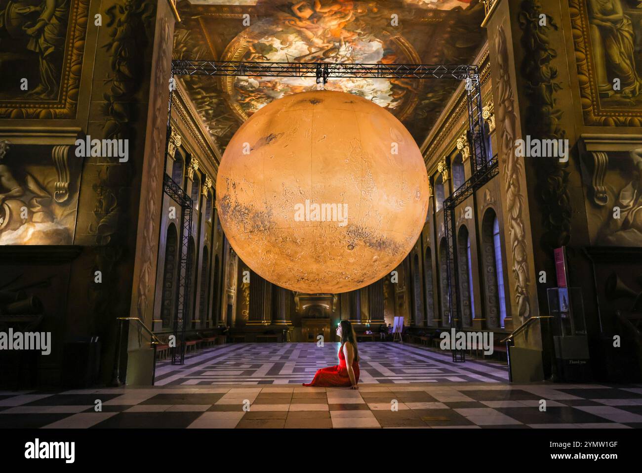 London, UK. 23rd Nov, 2024. Staff pose with the installation. The Old ...