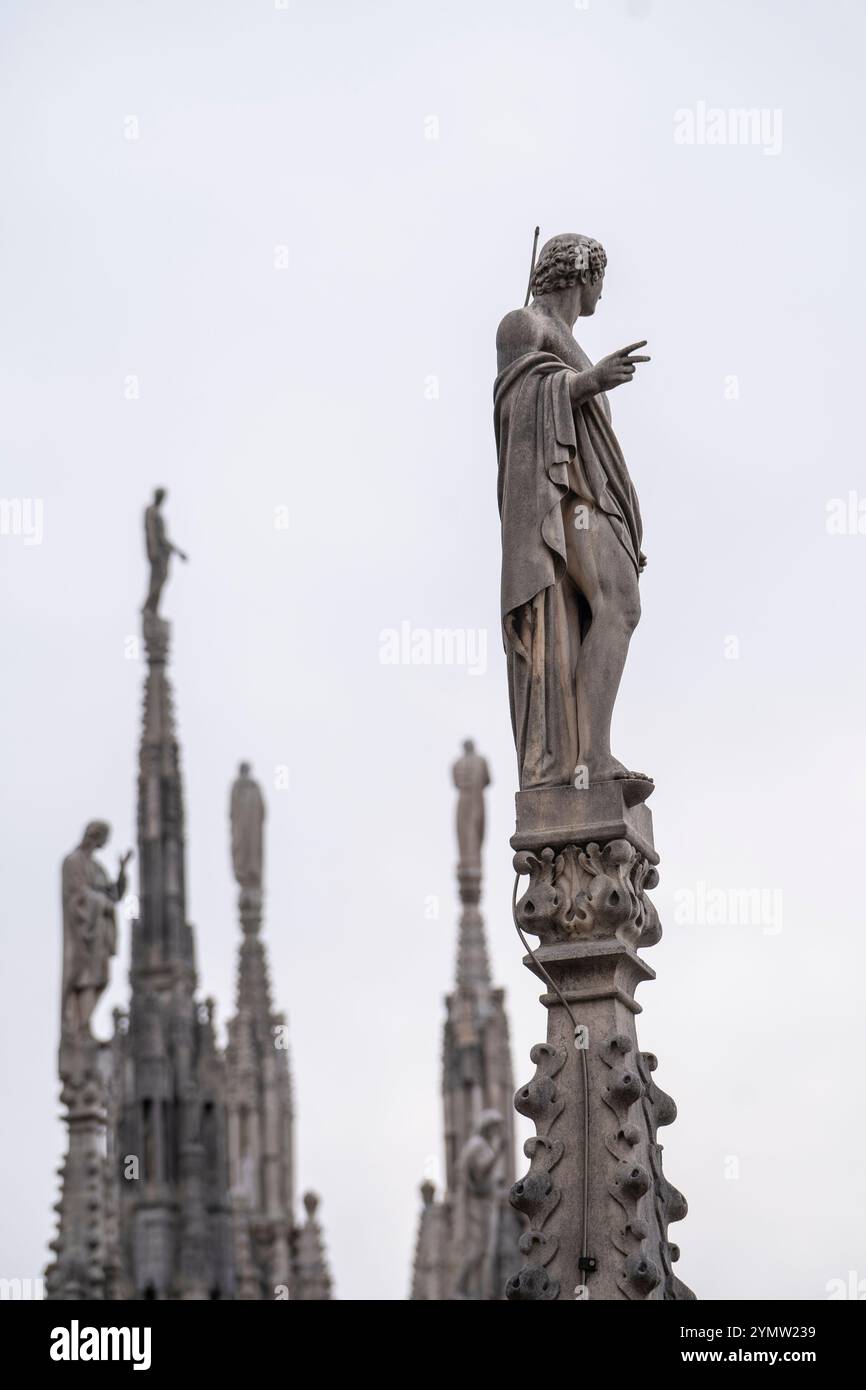 Cityscape rooftop view at exquisite gothic architecture of famous Duomo ...