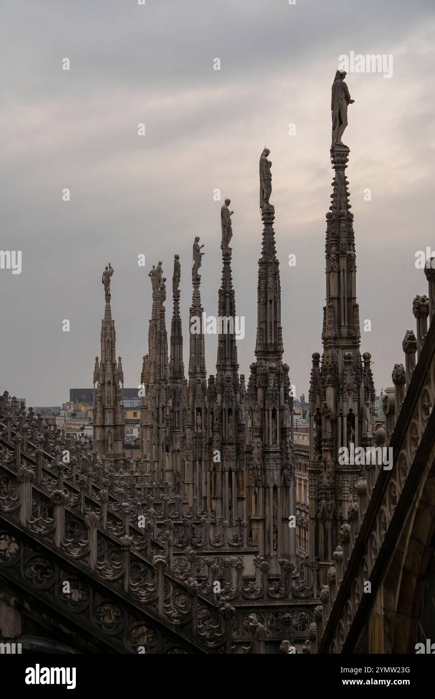 Cityscape rooftop view at exquisite gothic architecture of famous Duomo ...