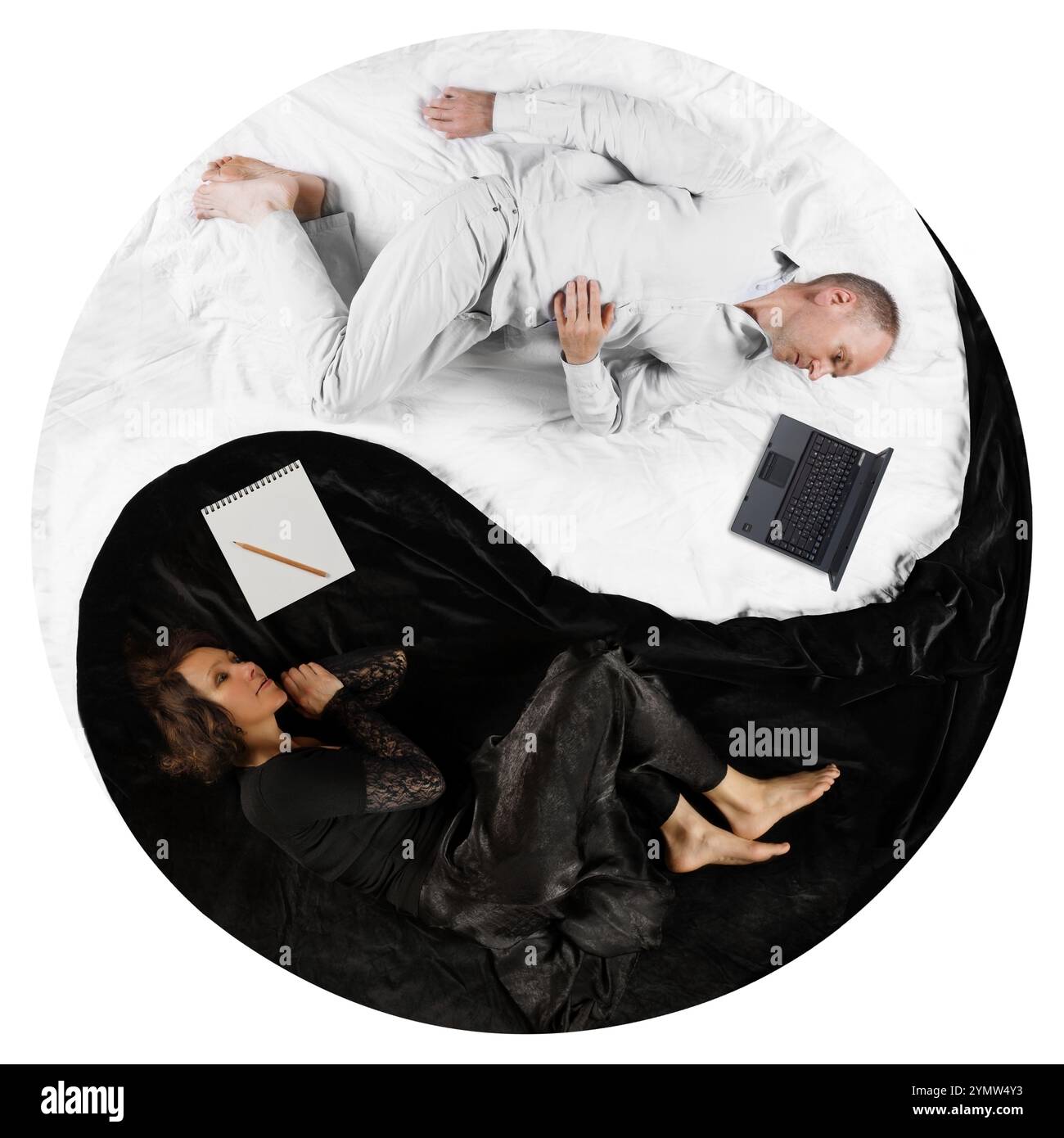 Top down view of adult couple lying in Yin Yang position indoors. Yin ...